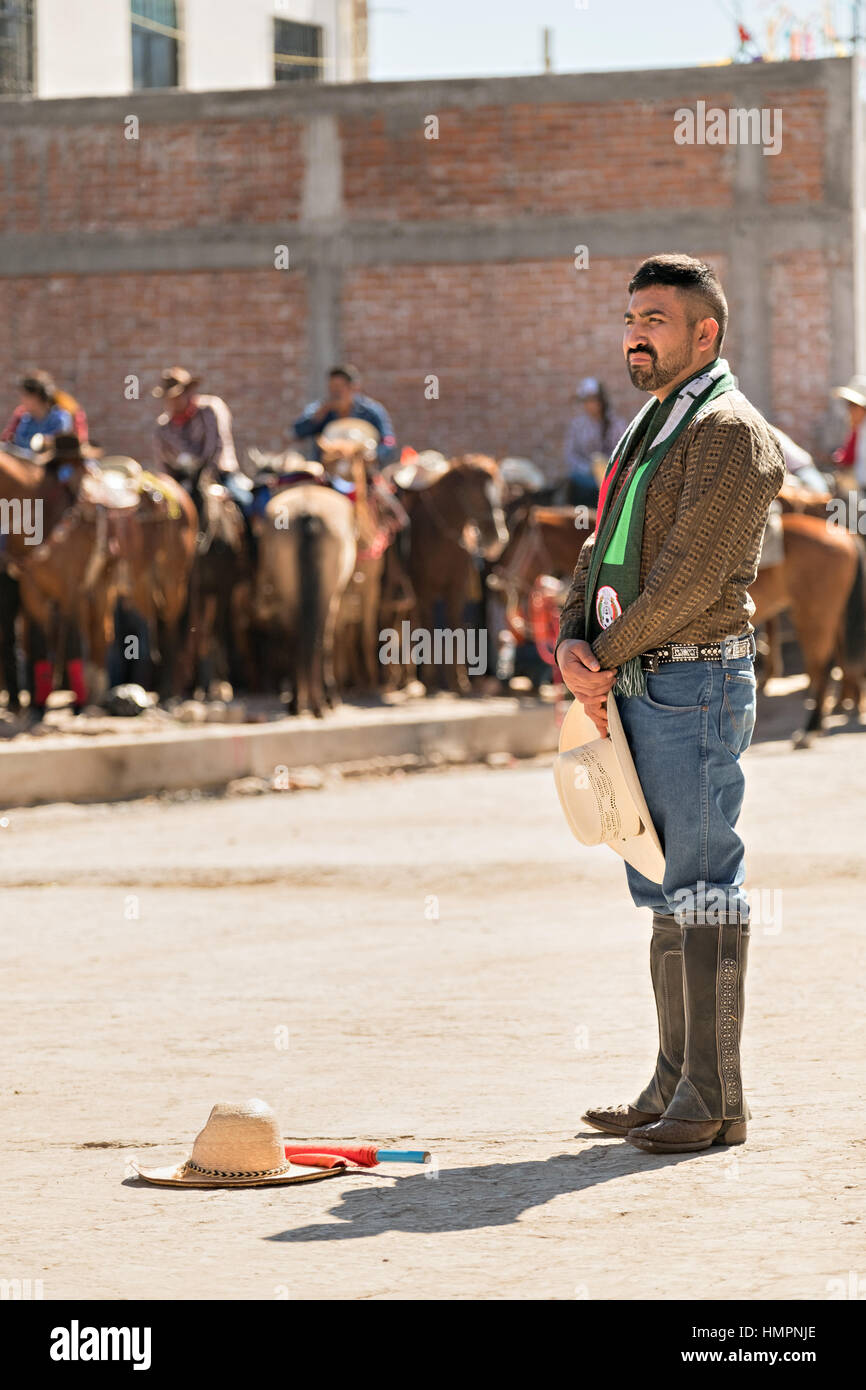 Mexican cowboys pray during Catholic mass at the San Martin de Terreros ...