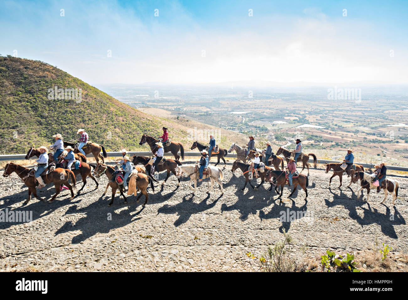 Three cowboys on horseback hi-res stock photography and images - Alamy