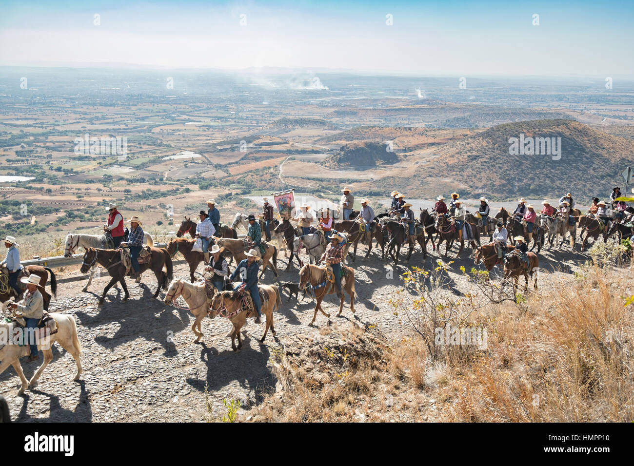 Three cowboys on horseback hi-res stock photography and images - Alamy