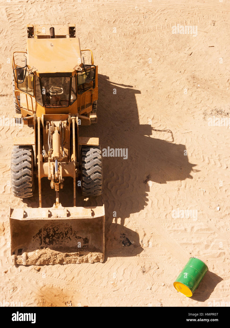 bulldozer and fuel barrel from above Stock Photo - Alamy