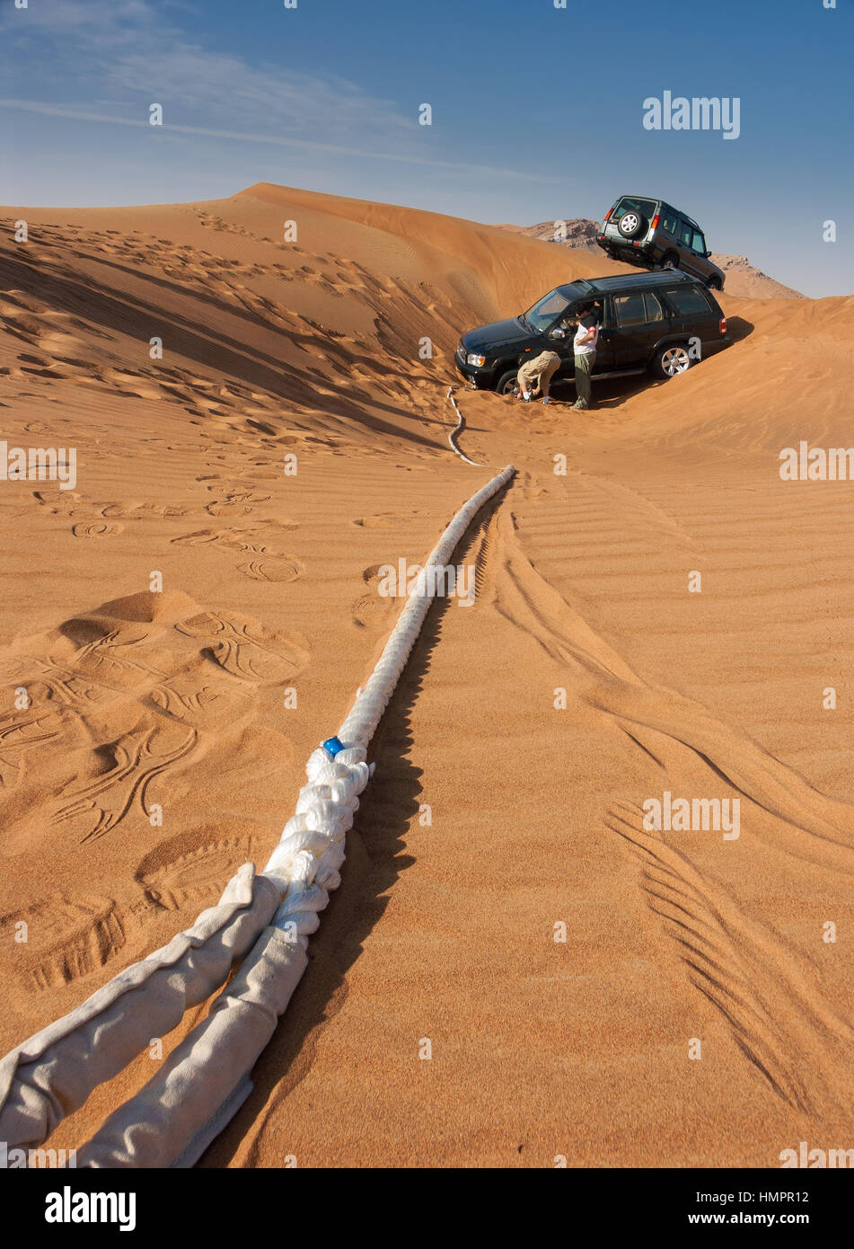 two cars off-road one stuck in sand Stock Photo - Alamy