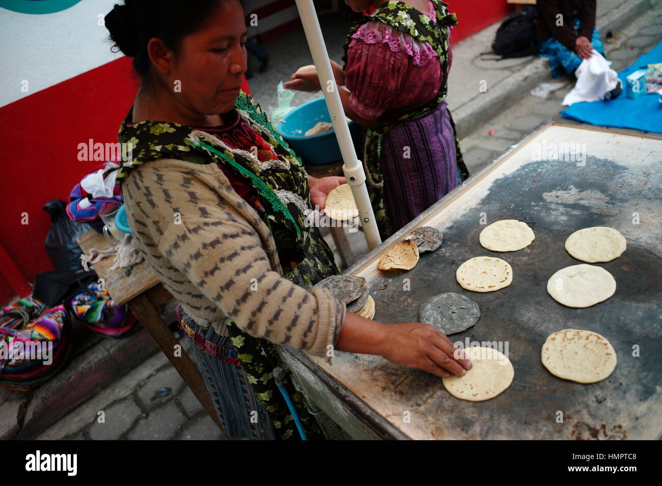Street vendor selling traditional corn arepas Stock Photo - Alamy