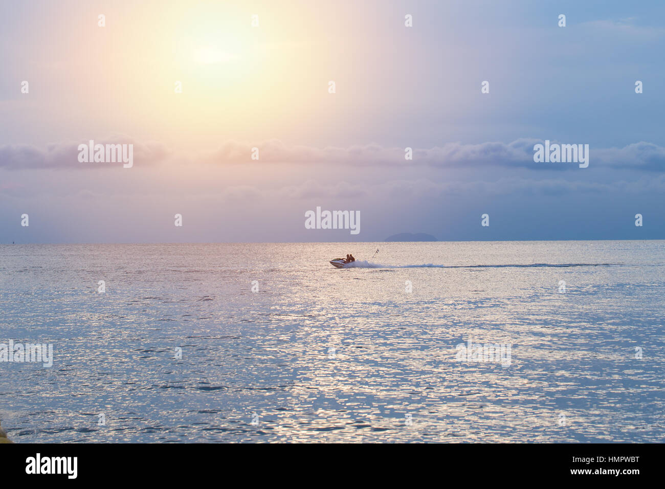 summer sea, seascape with people on boat passing sun light shining on ...