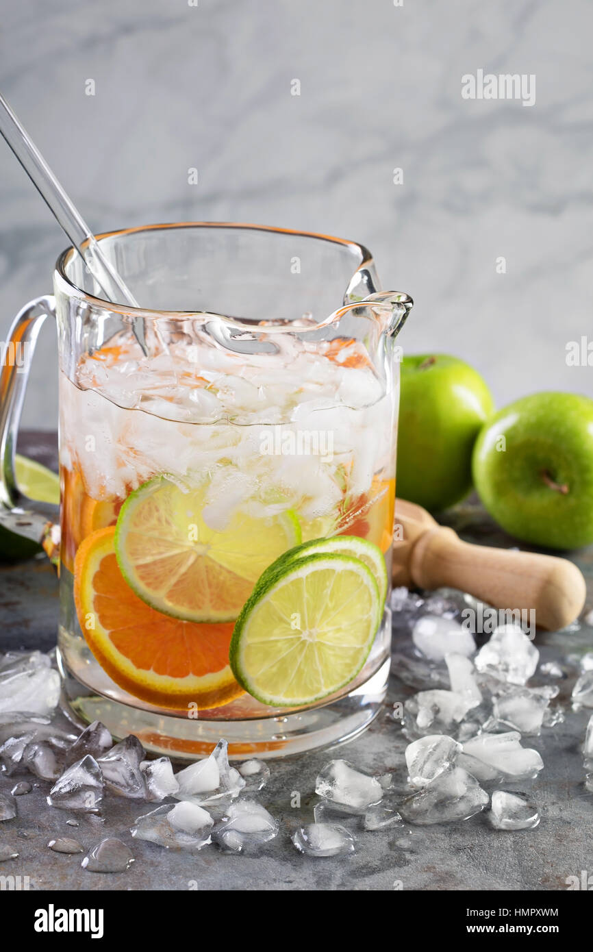 Infused water with citrus fruits in a pitcher Stock Photo - Alamy