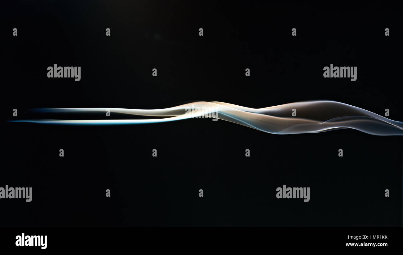 abstract elegant smoke lines isolated on black Stock Photo - Alamy