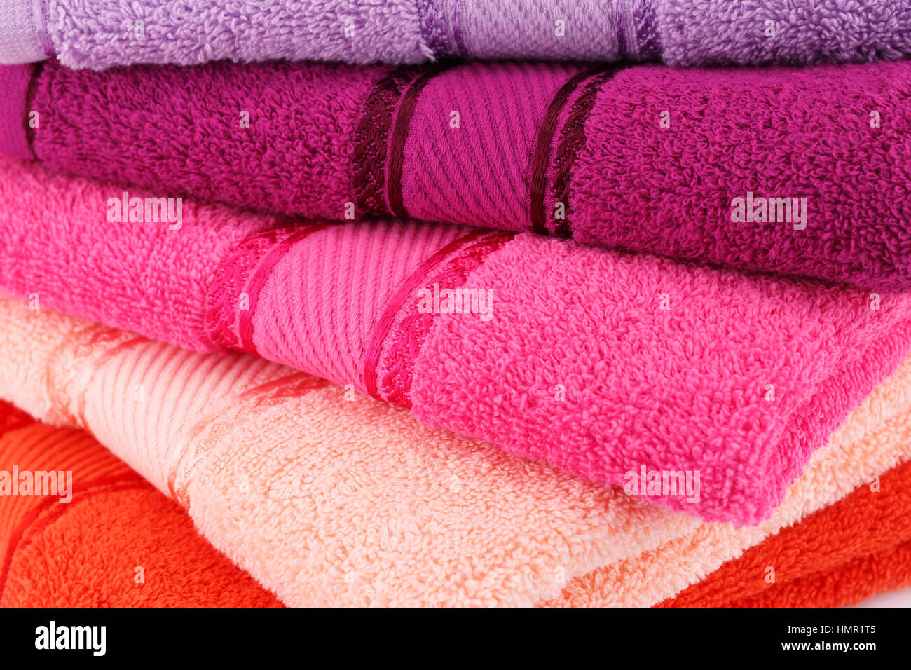 Colorful towels stack closeup picture Stock Photo - Alamy
