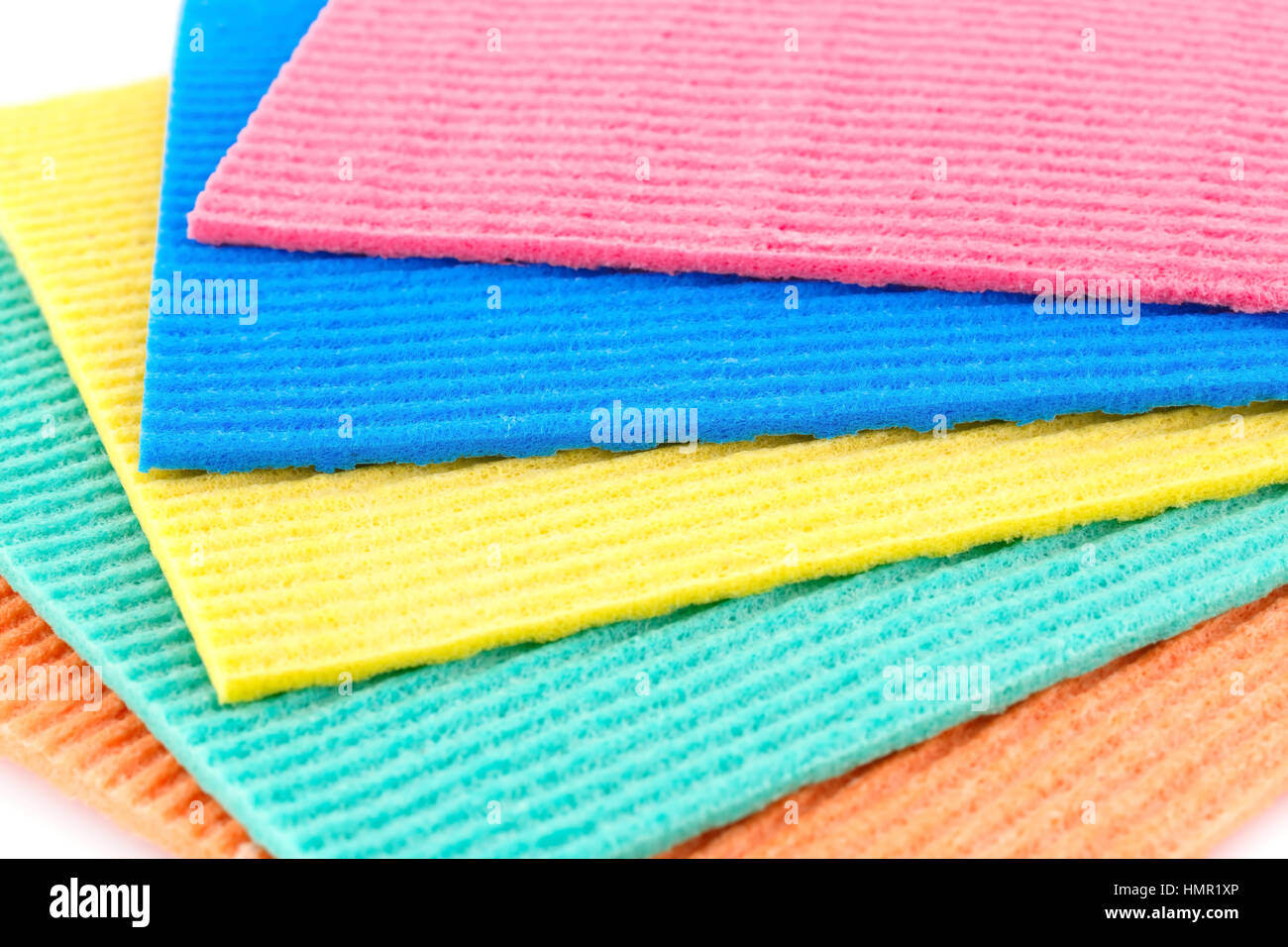Colorful sponges on white background Stock Photo - Alamy