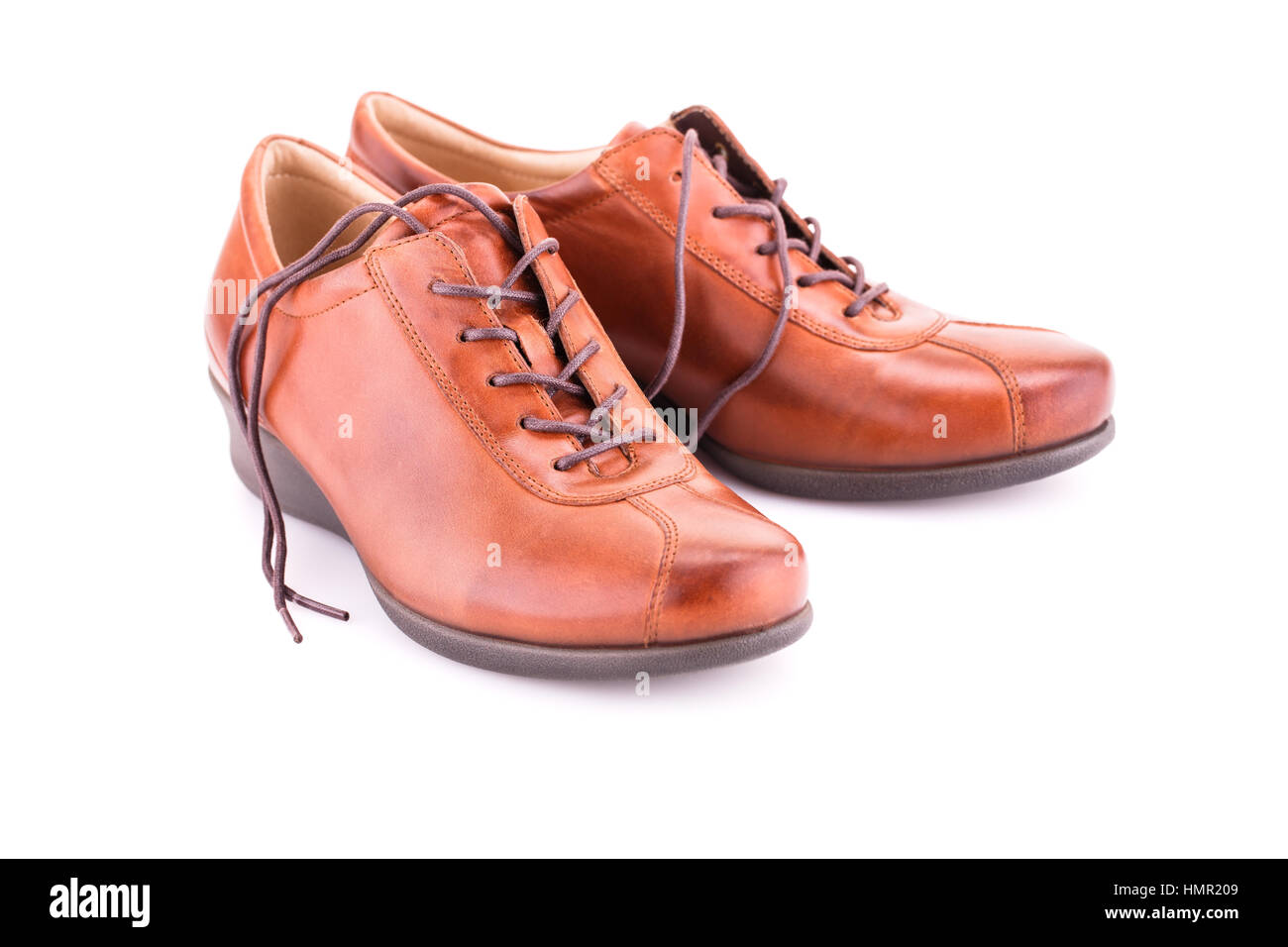 Pair of brown shoes isolated on white background Stock Photo - Alamy