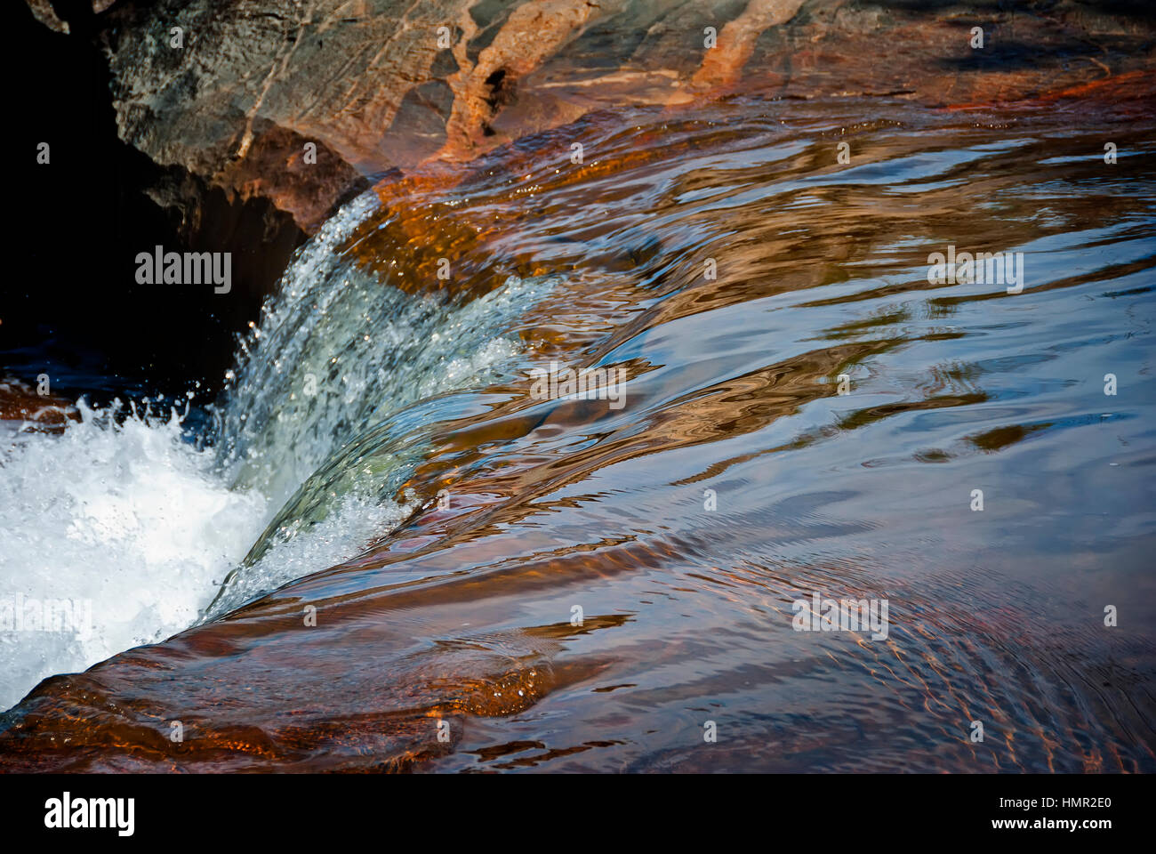 Water running over rocks Stock Photo - Alamy