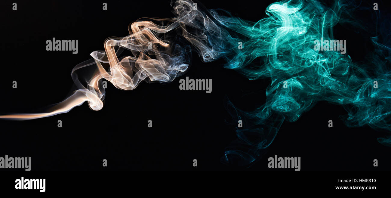 smoke color swirles isolated on black background Stock Photo - Alamy