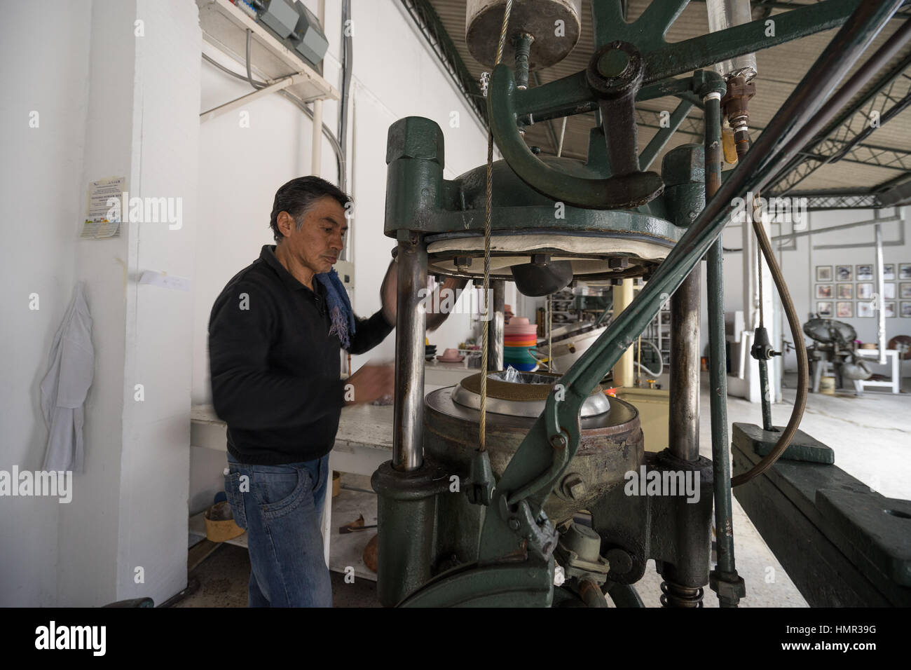 July 20, 2016 Cuenca, Ecuador: a man is operating a high heat stem ...