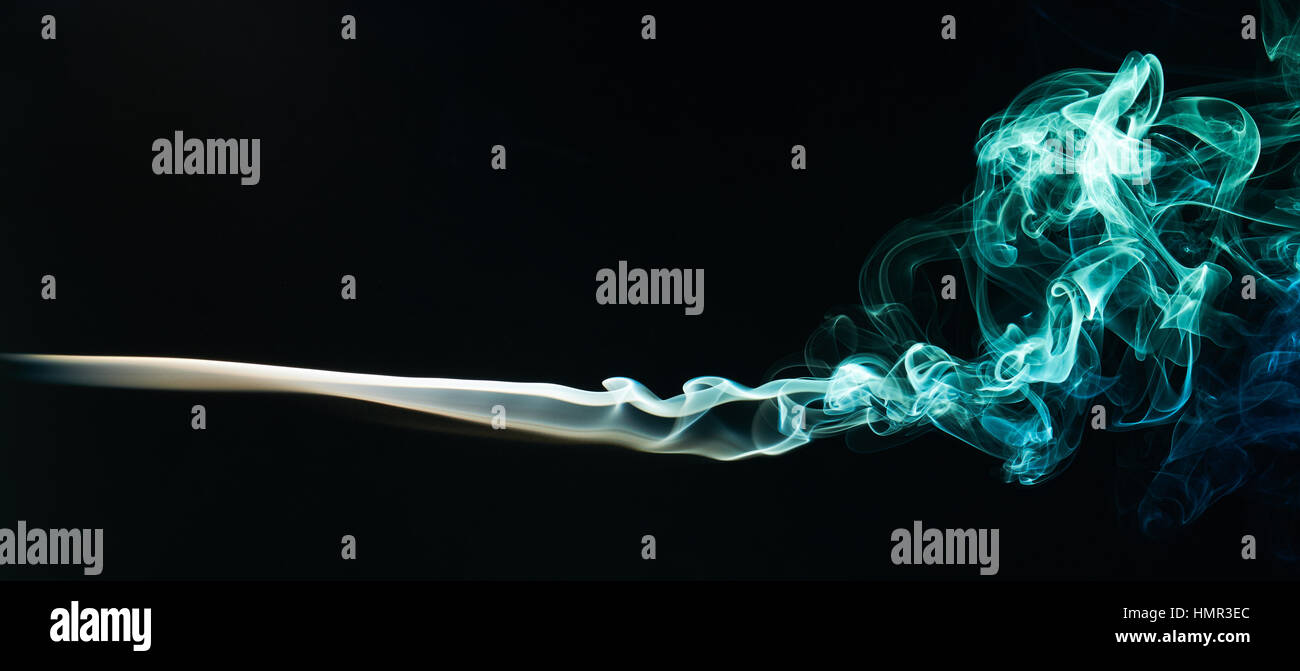 smoke color swirles isolated on black background Stock Photo - Alamy