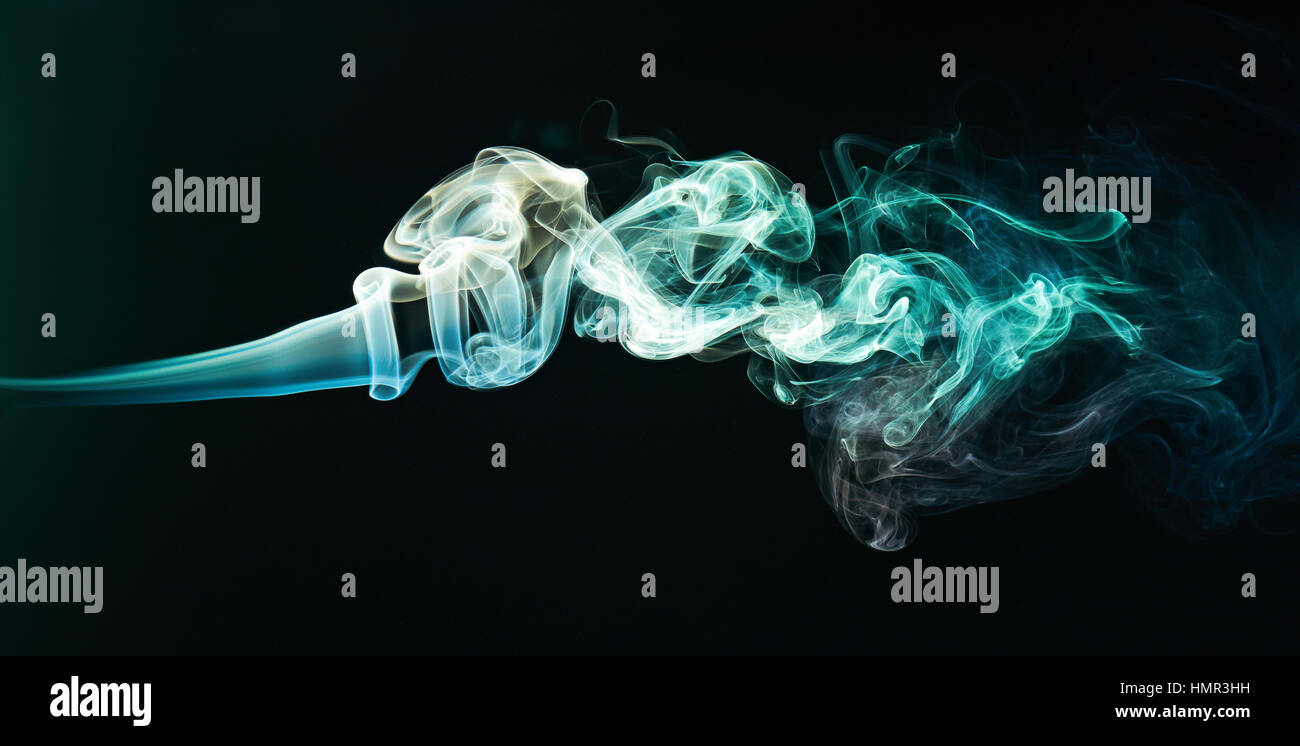 colorful curly smoke isolated on black background Stock Photo - Alamy