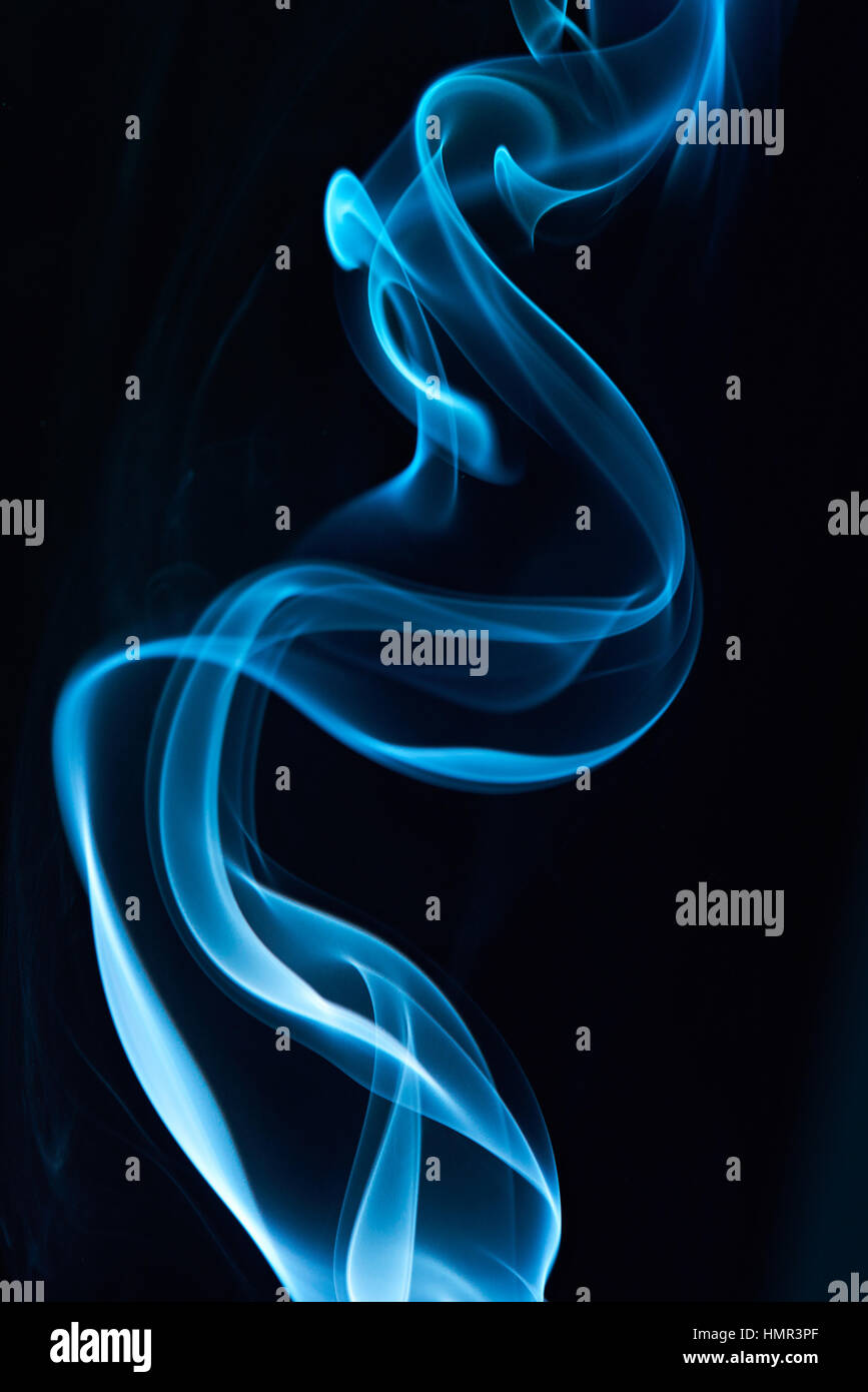 close up of elegant blue smoke lines on black Stock Photo - Alamy