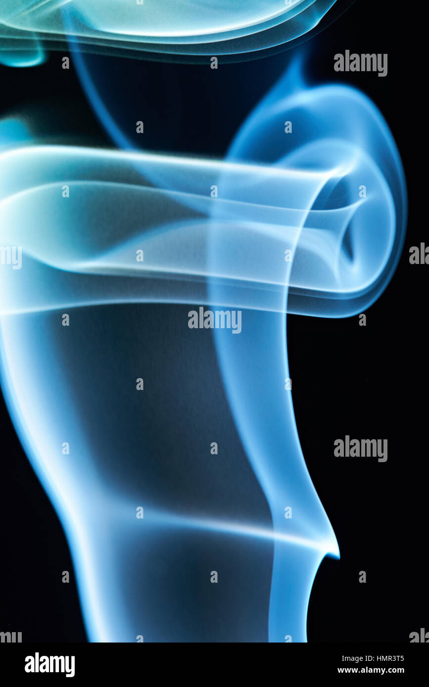 macro of blue smoke curve isolated on black background Stock Photo - Alamy