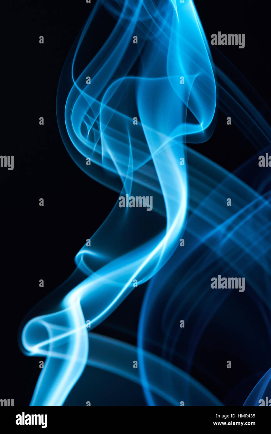 macro of blue smoke lines on black background Stock Photo - Alamy