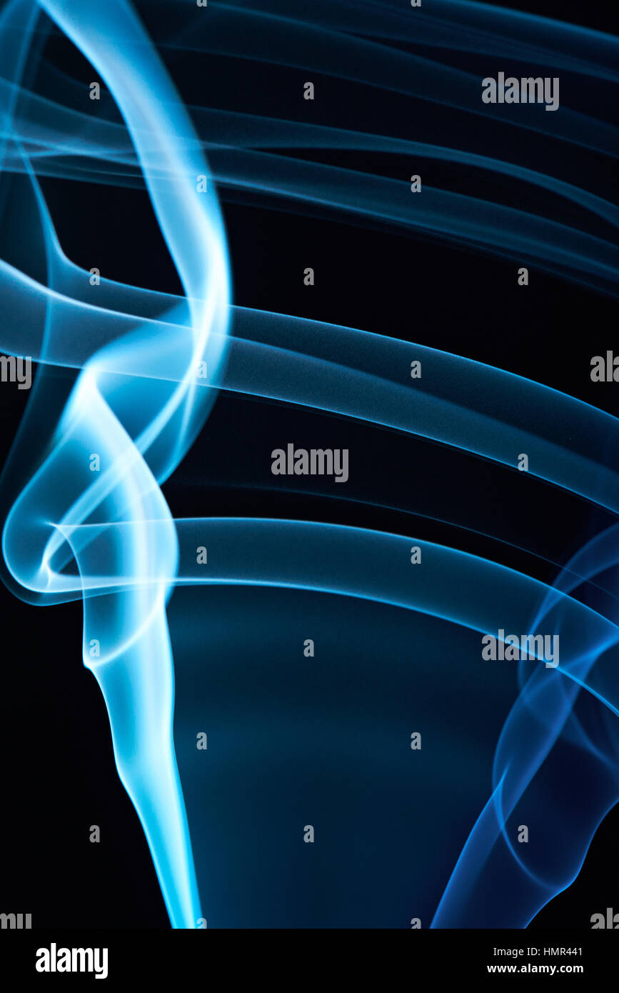 smoke blue abstract lines on black background Stock Photo - Alamy