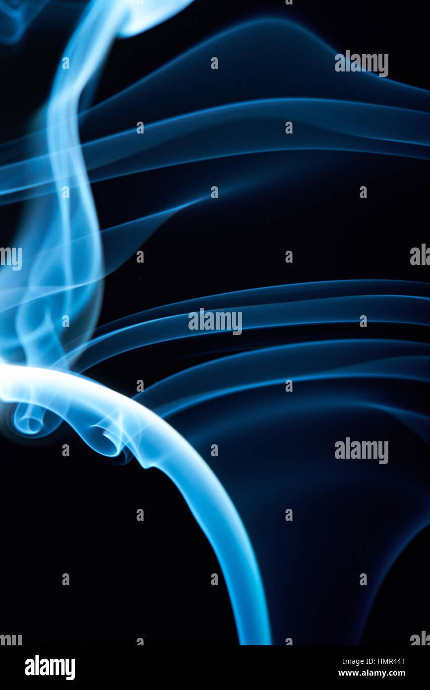Abstract blue smoke lines on black background Stock Photo - Alamy