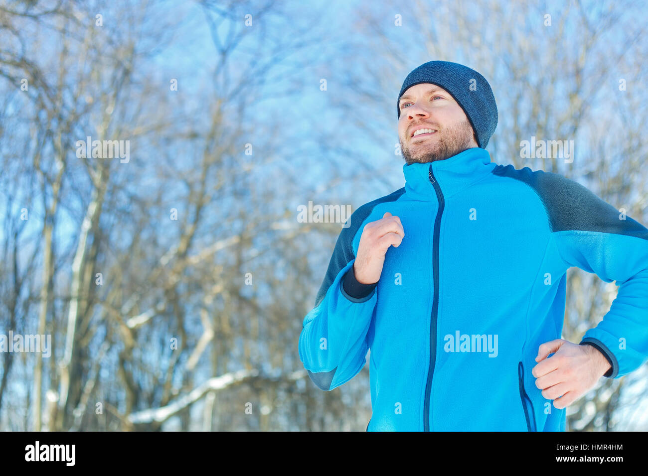 running man outdoors in winter Stock Photo - Alamy