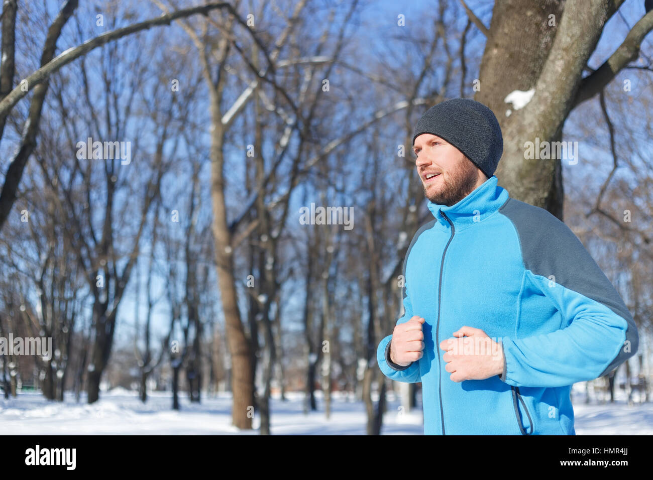 young man running in winter Stock Photo - Alamy
