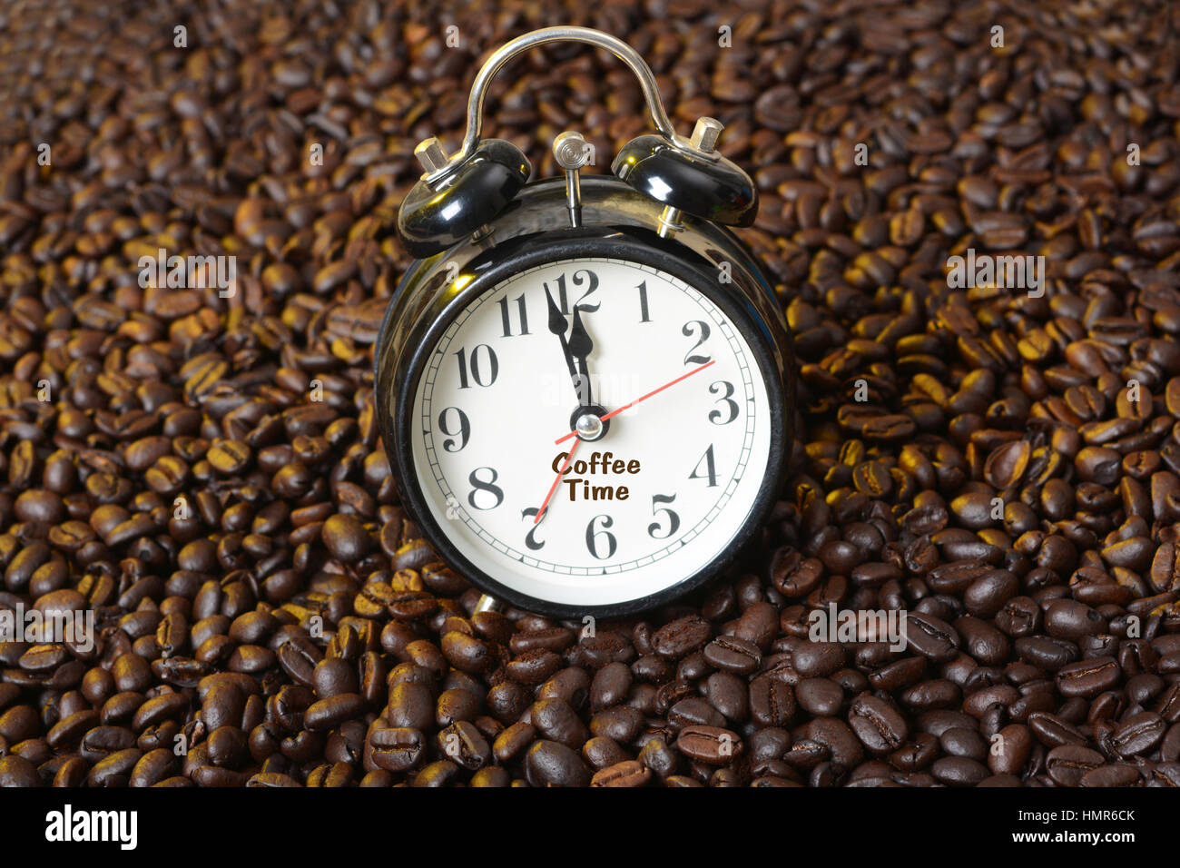 Coffee Time sign clock in beans background Stock Photo - Alamy