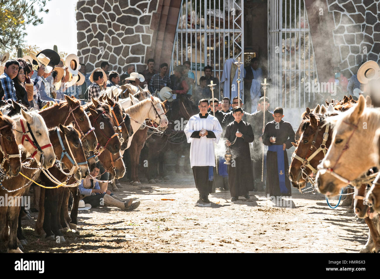 Catholic priests begin the procession at the start of mass for ...