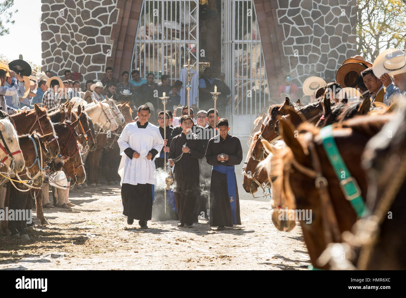 Catholic priests begin the procession at the start of mass for ...