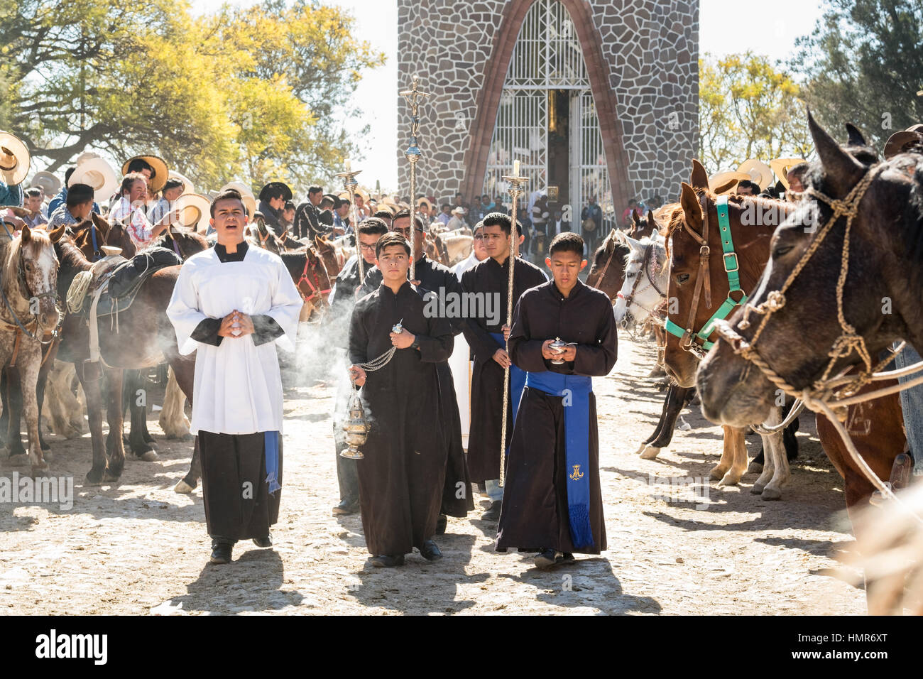Catholic priests begin the procession at the start of mass for ...