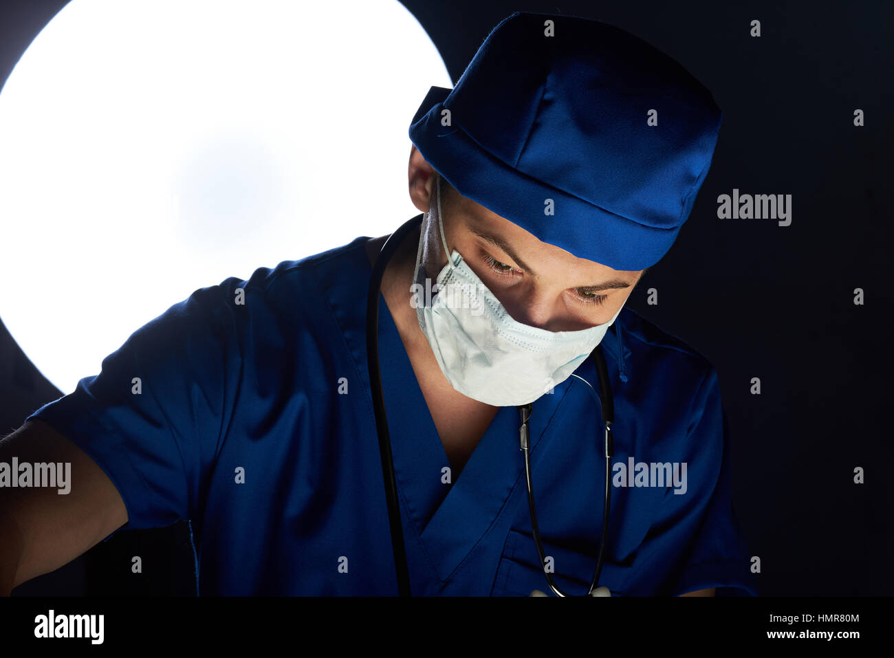 young doctor man focusing on operation in hospital Stock Photo - Alamy