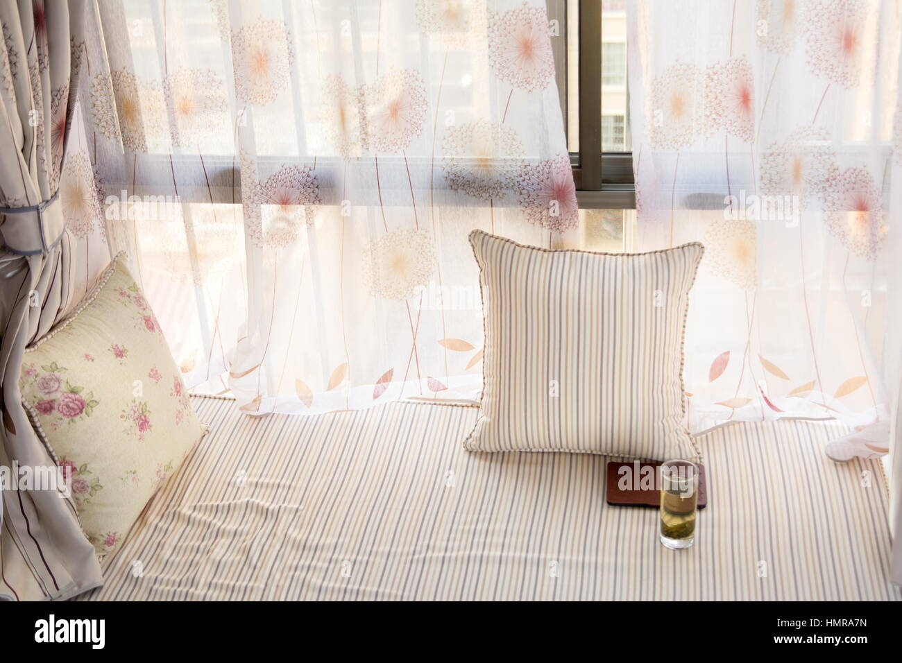 Bay window interior with matching mattress and curtain Stock Photo - Alamy