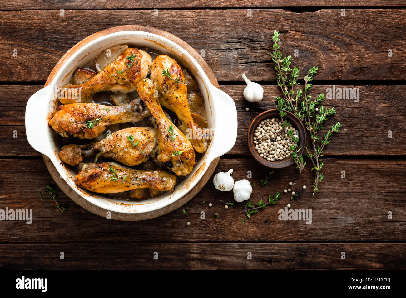 Roasted chicken legs on rustic wooden background, top view Stock Photo ...