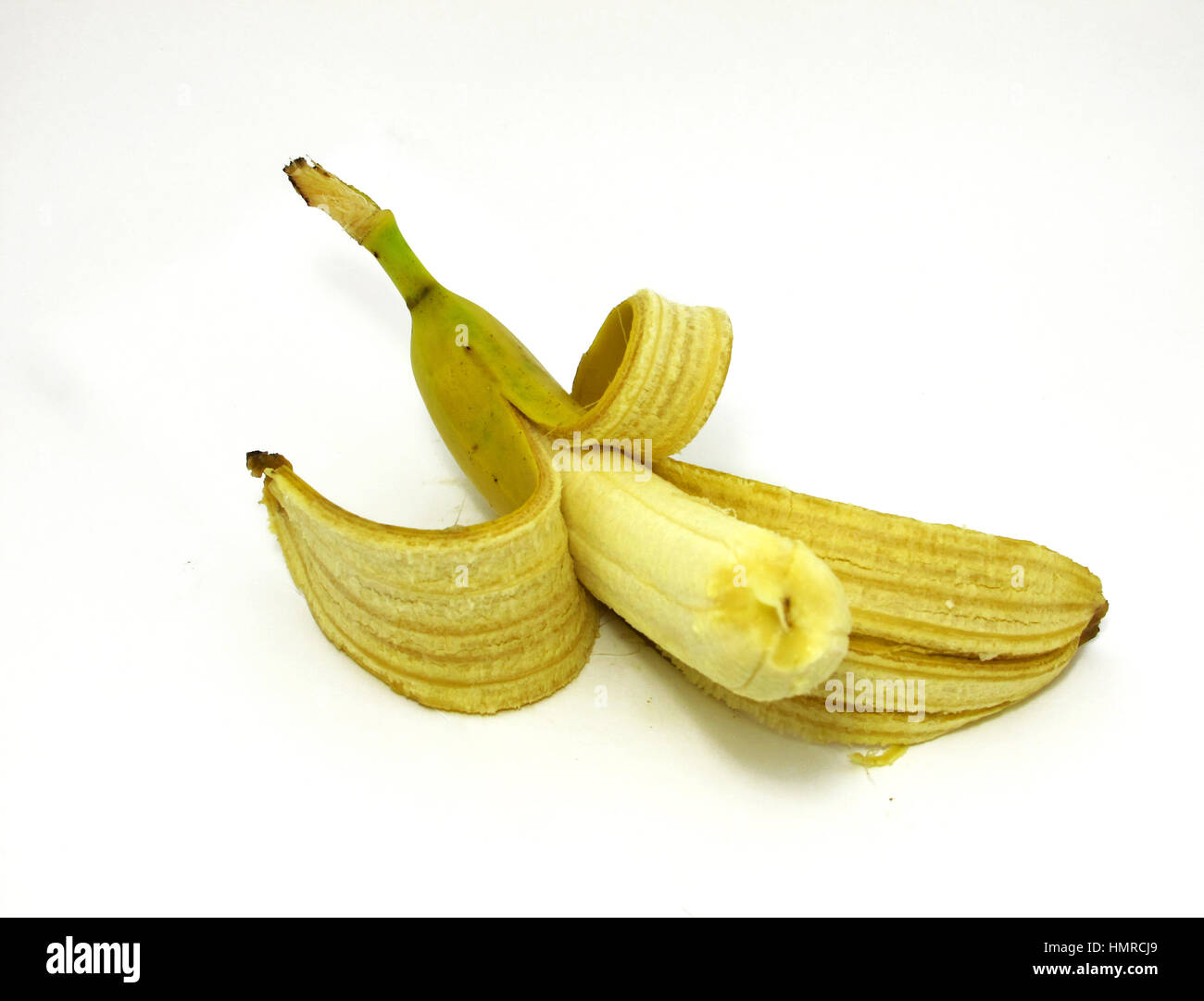 Yellow ripe opened banana on a white background Stock Photo - Alamy