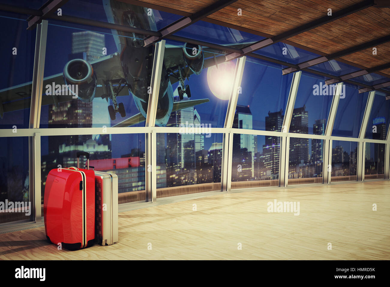luggage at the airport terminal - night scene with a plane flying ...