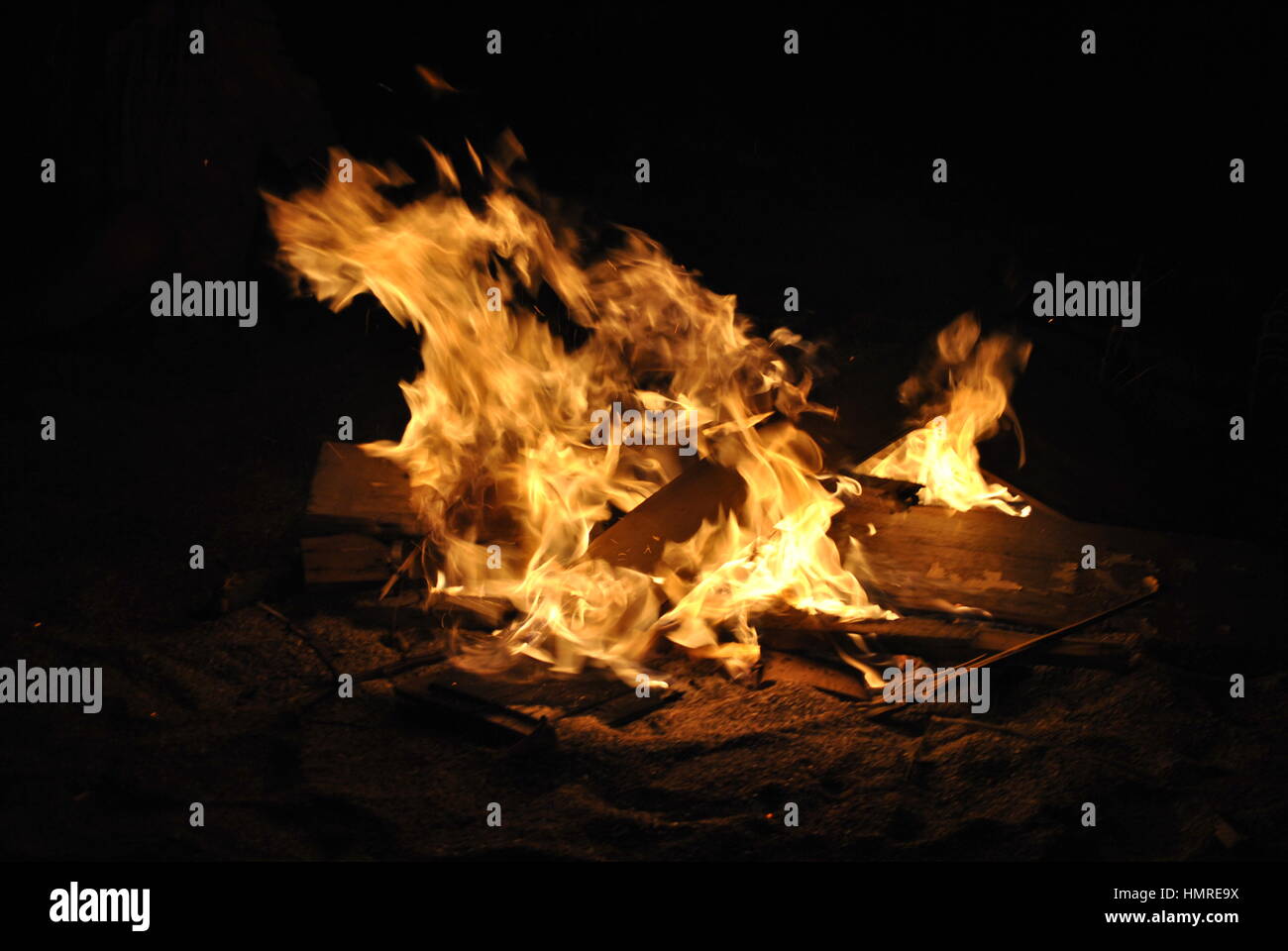 Campfire in the dark Stock Photo - Alamy