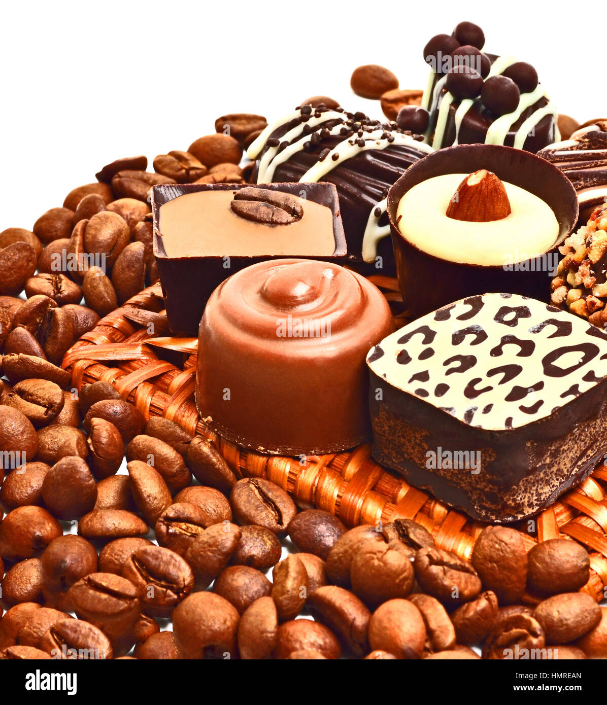 Various chocolate sweets and coffee grains isolated on white Stock ...