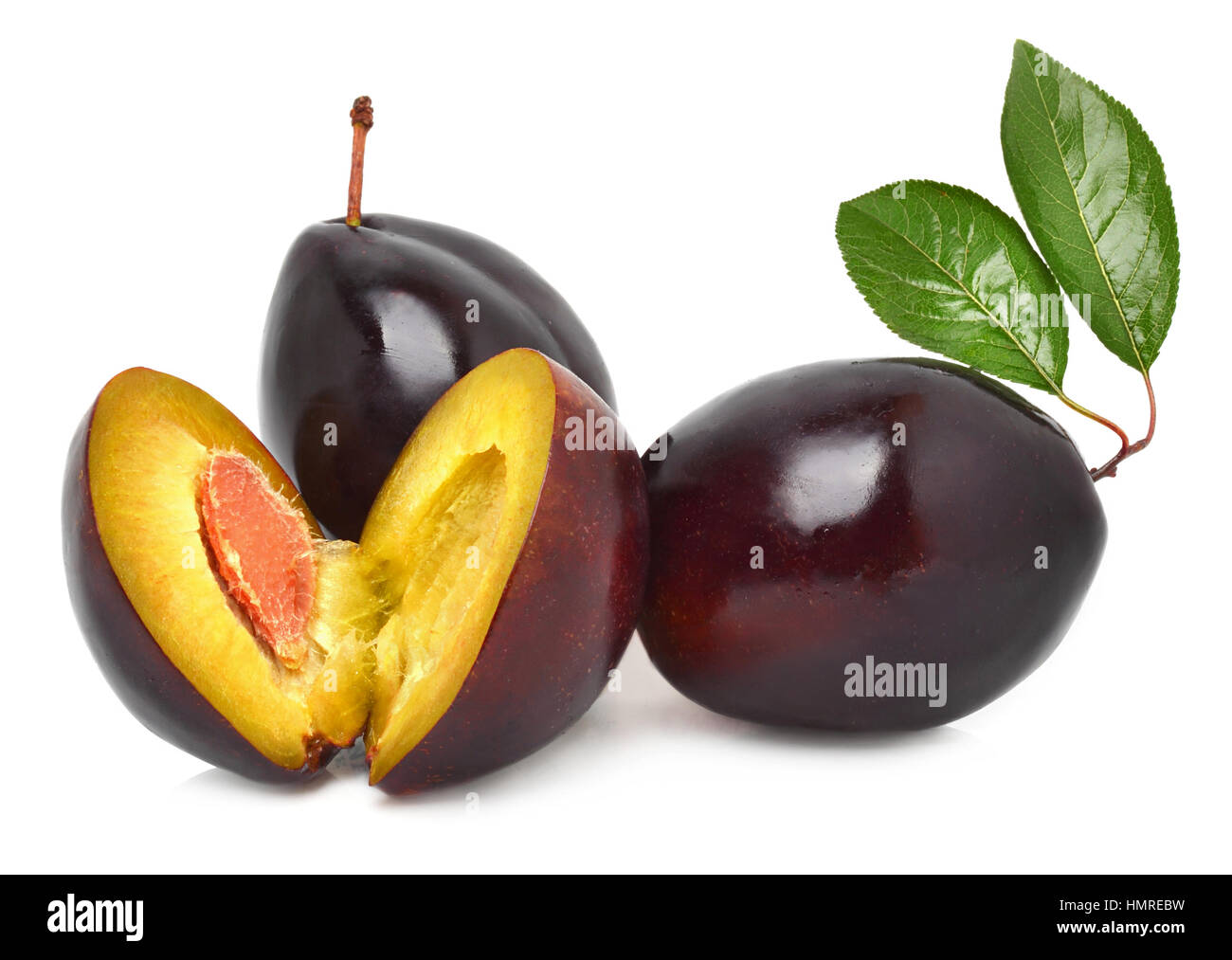 Three sweet plums isolated on the white background Stock Photo - Alamy