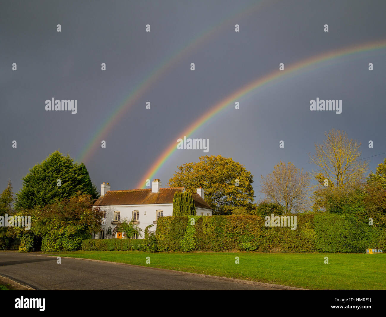 english rural cottage rainbow Stock Photo - Alamy
