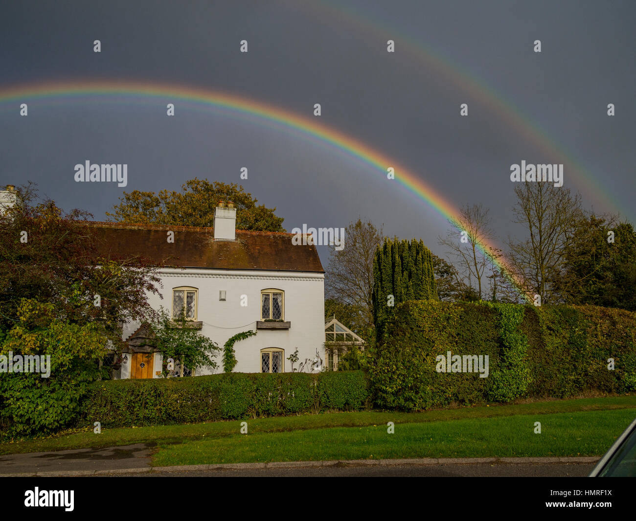 english rural cottage rainbow Stock Photo - Alamy
