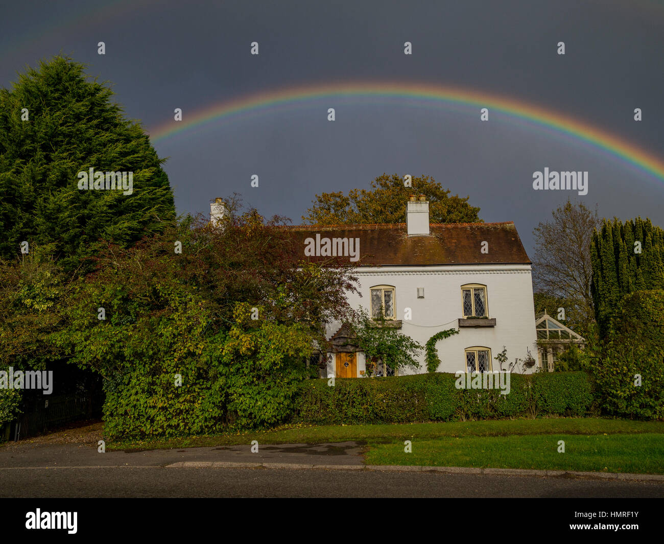 english rural cottage rainbow Stock Photo - Alamy