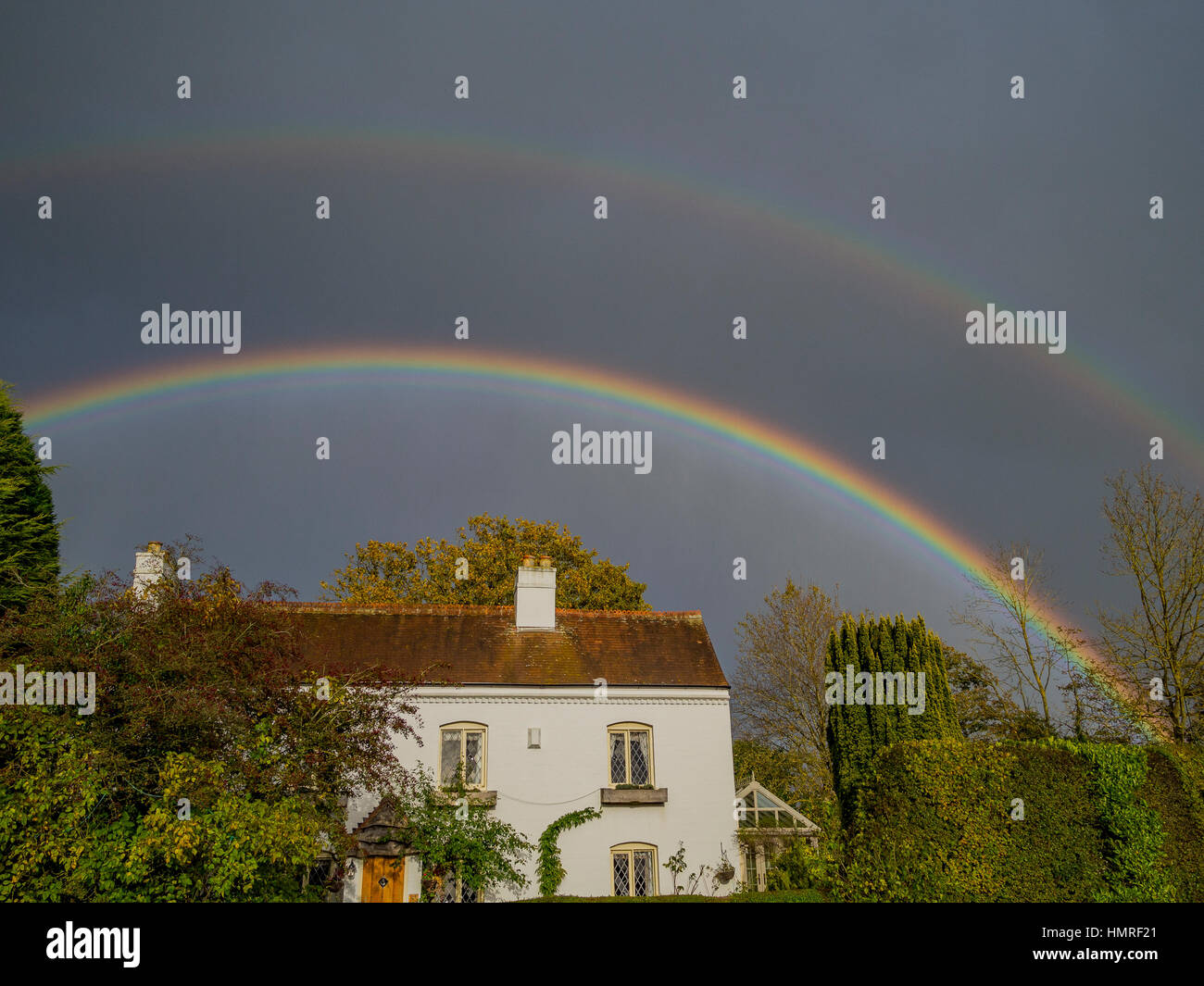 english rural cottage rainbow Stock Photo - Alamy