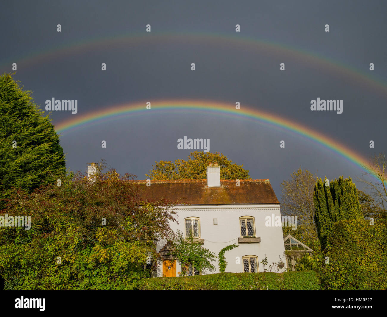 english rural cottage rainbow Stock Photo - Alamy