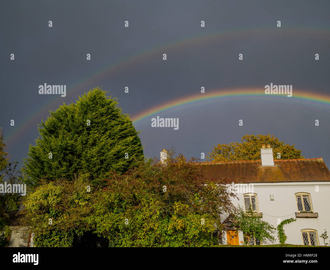 english rural cottage rainbow Stock Photo - Alamy