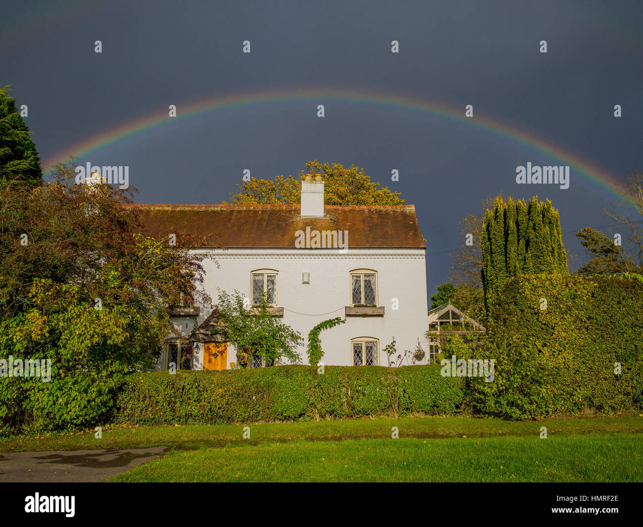 english rural cottage rainbow Stock Photo - Alamy