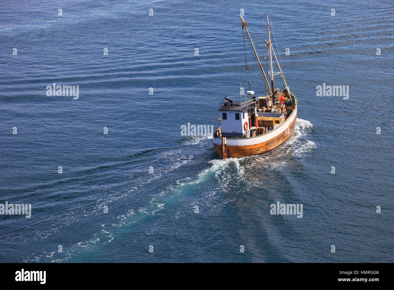 Old wooden fishing boat trawler on sea Stock Photo - Alamy