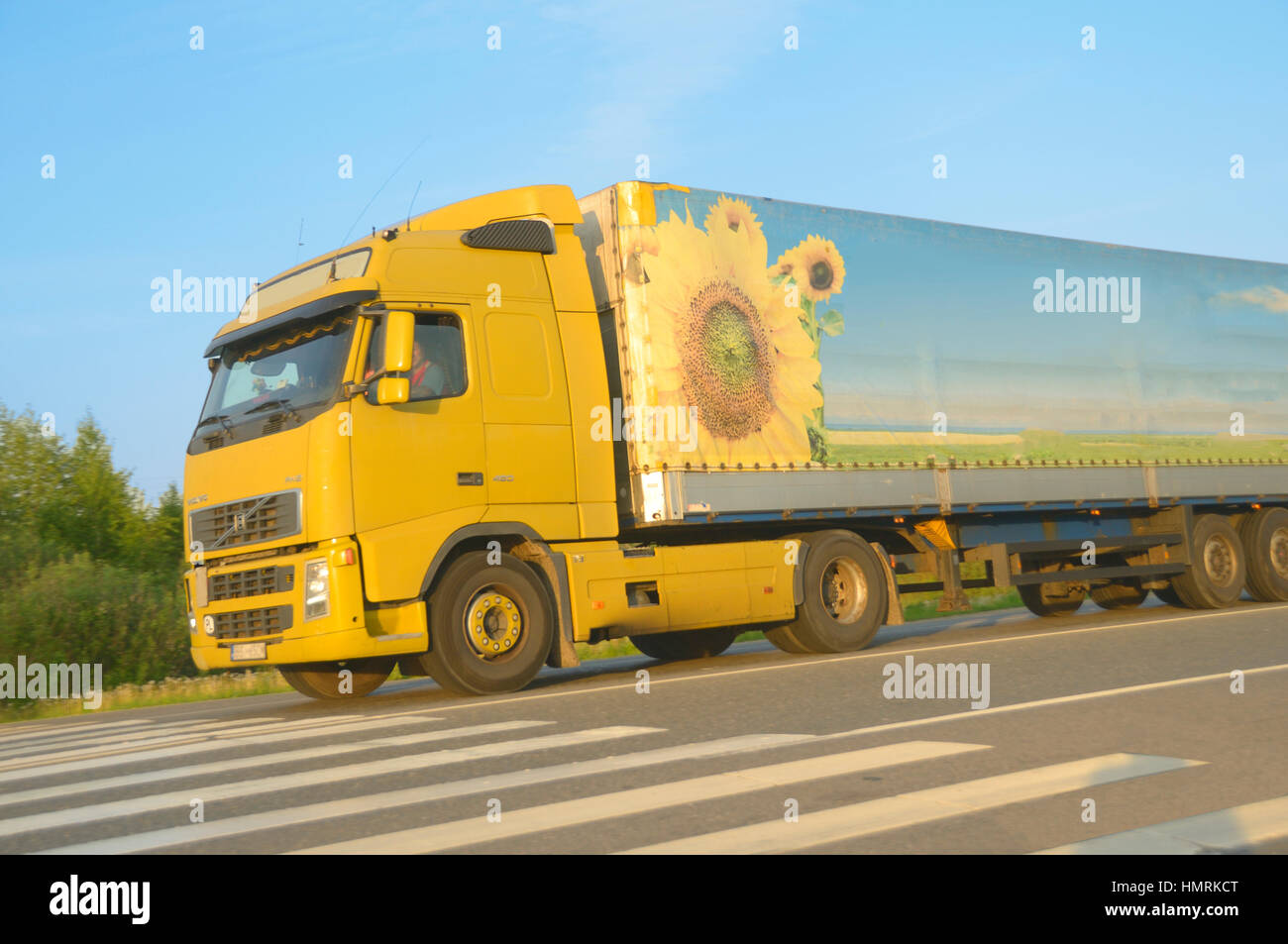 The heavy truck goes on highway Stock Photo - Alamy