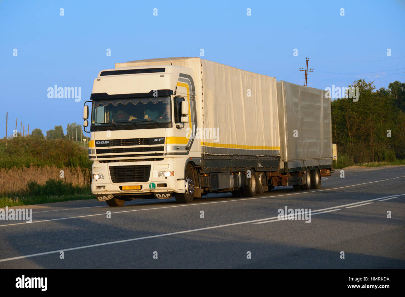 The heavy truck goes on highway Stock Photo - Alamy