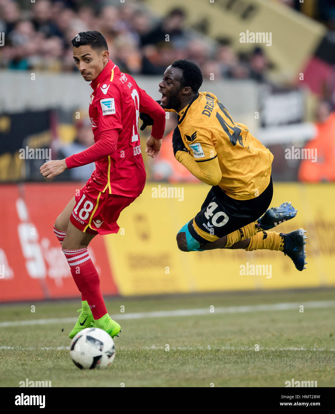 Dresden, Germany. 5th Feb, 2017. Dresden's Erich Berko (R) stumbles ...