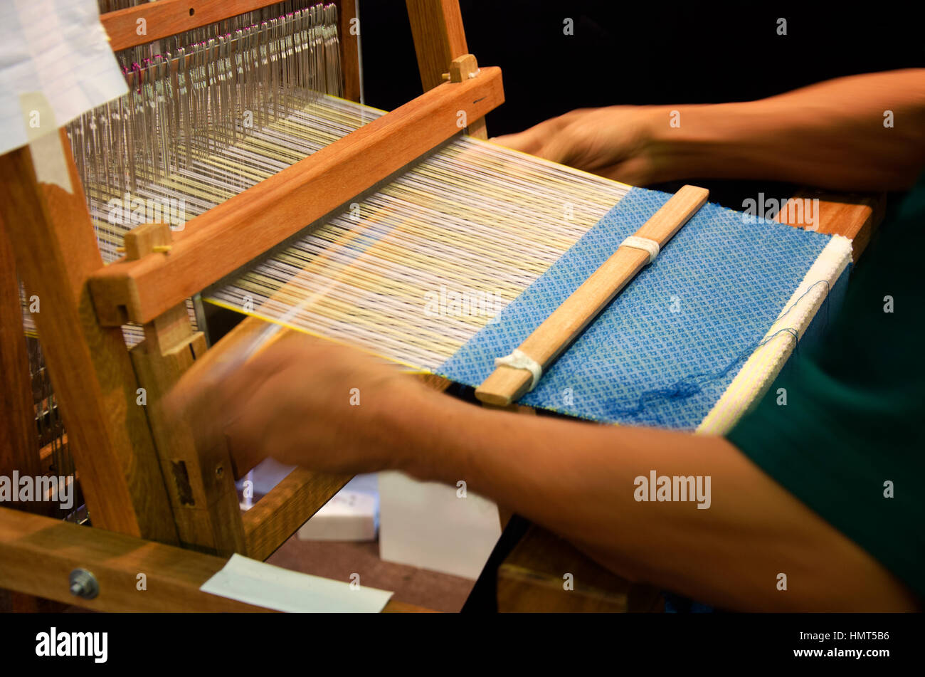 Thai people using small loom or weaving machine for weaving show ...