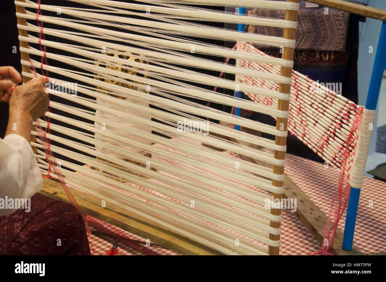 Thai senior woman people tie cotton yarn before dyeing technique used ...