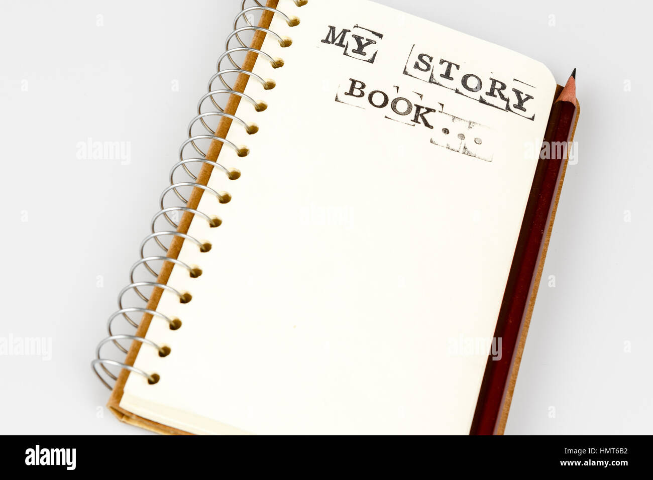 My story book on the white, Diary with text and pencil Stock Photo - Alamy